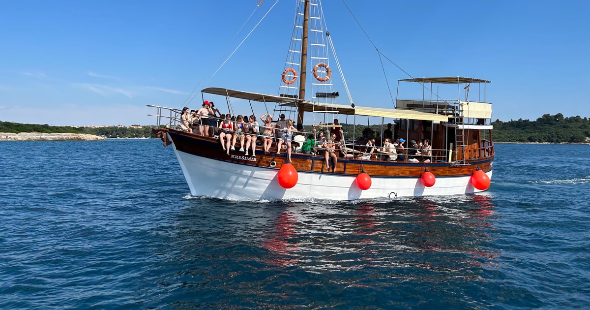 Pula: Dolphin Sunset cruise on Traditional Wooden Boat | GetYourGuide