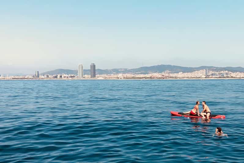 Barcelona: Coastline Boat Trip with Snacks and Cava | GetYourGuide