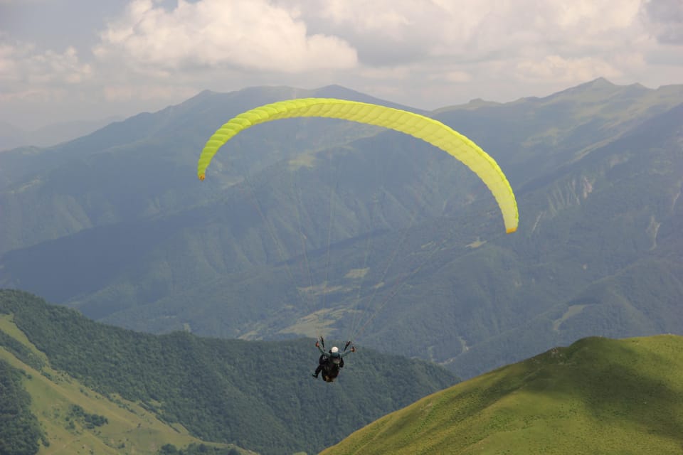 Georgia: Paragliding flight in the mountains and video of it | GetYourGuide