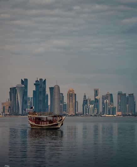 Doha: traditional Dhow Harbour, Skyline view , Sunset | GetYourGuide