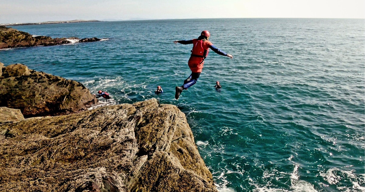 Coasteering on Anglesey (cliff jumping, climbing, swimming) | GetYourGuide